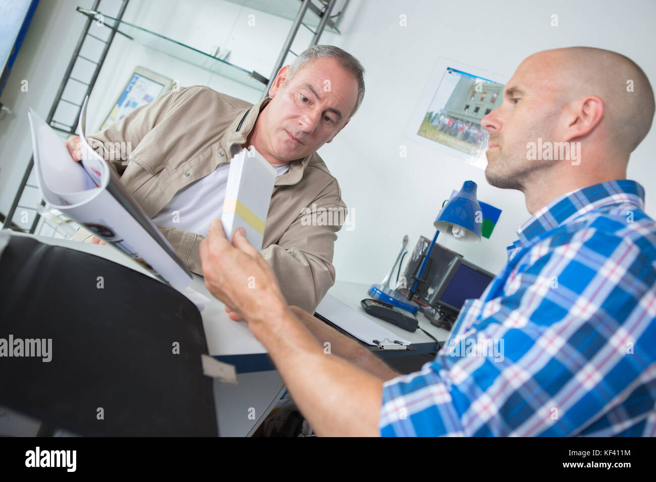 seller explaining and presentation project to customer in office Stock ...
