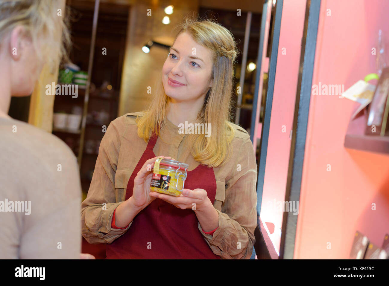 woman shopping and store assistant showing the best product Stock Photo ...