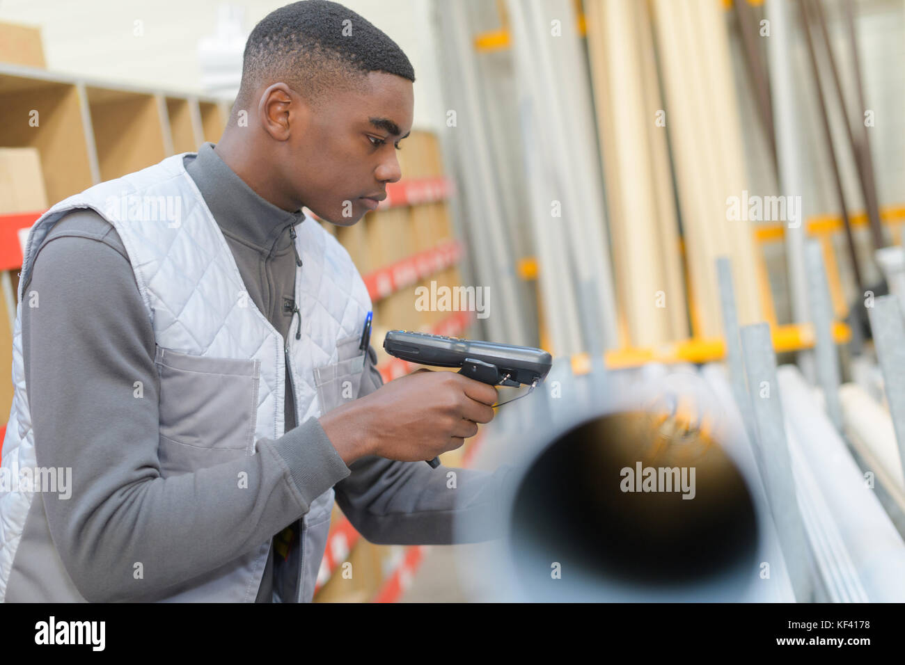 worker using scanner in the warehouse Stock Photo - Alamy