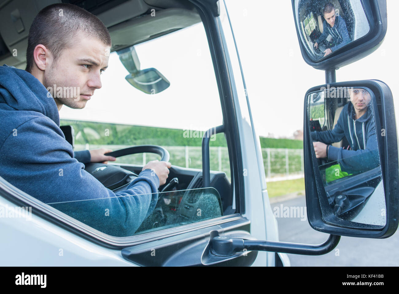 young worker driving a truck Stock Photo - Alamy