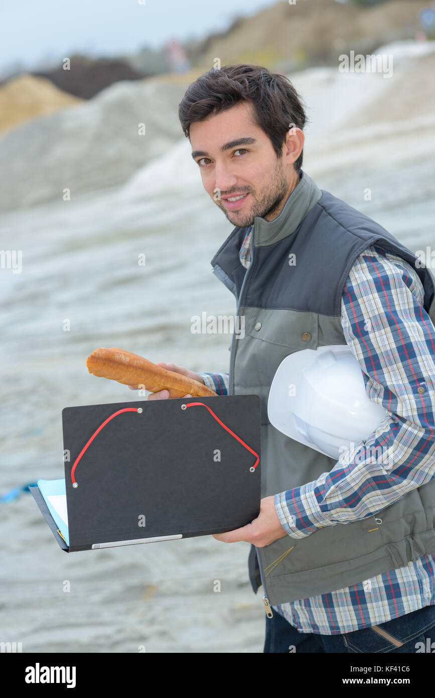 worker bringing a bread Stock Photo - Alamy