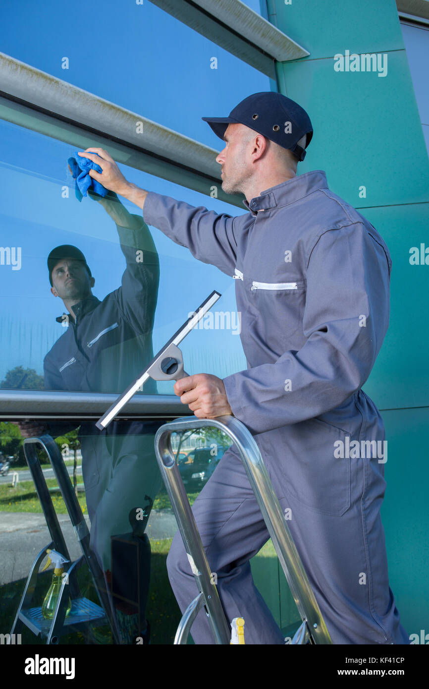man cleaning window Stock Photo - Alamy