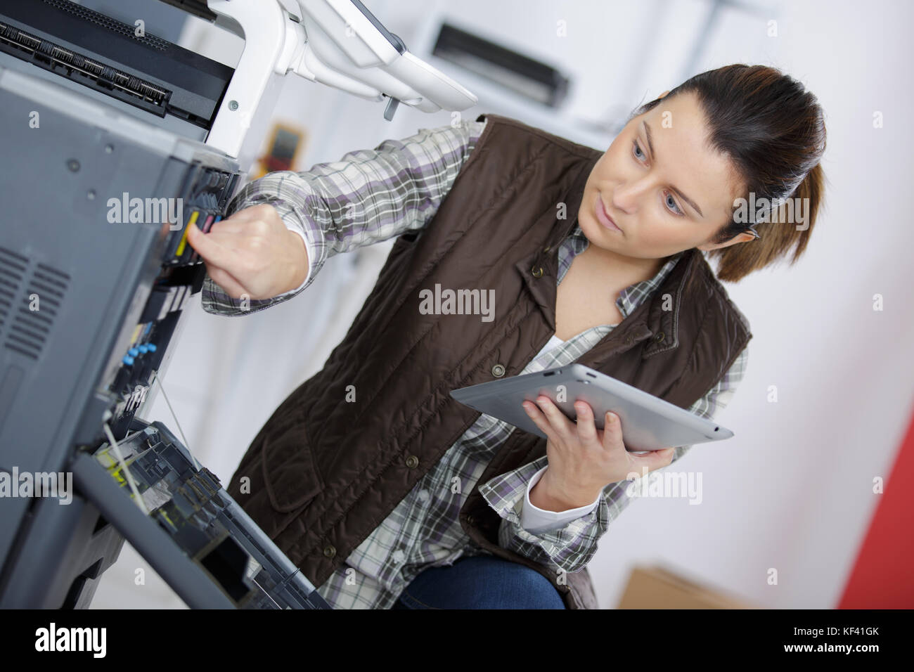 young female printer technician Stock Photo - Alamy