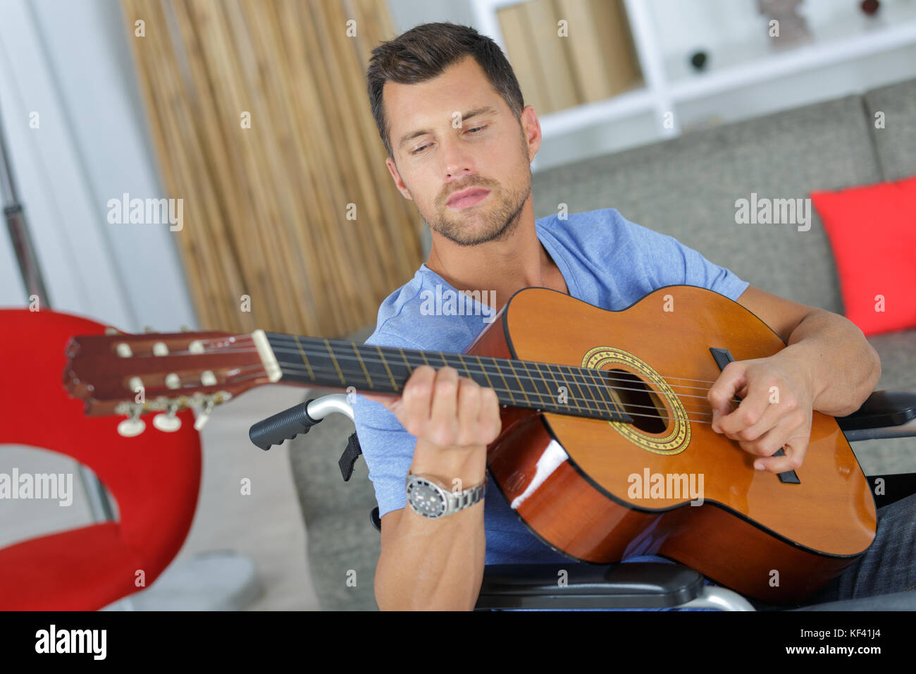 focused musician playing guitar Stock Photo - Alamy