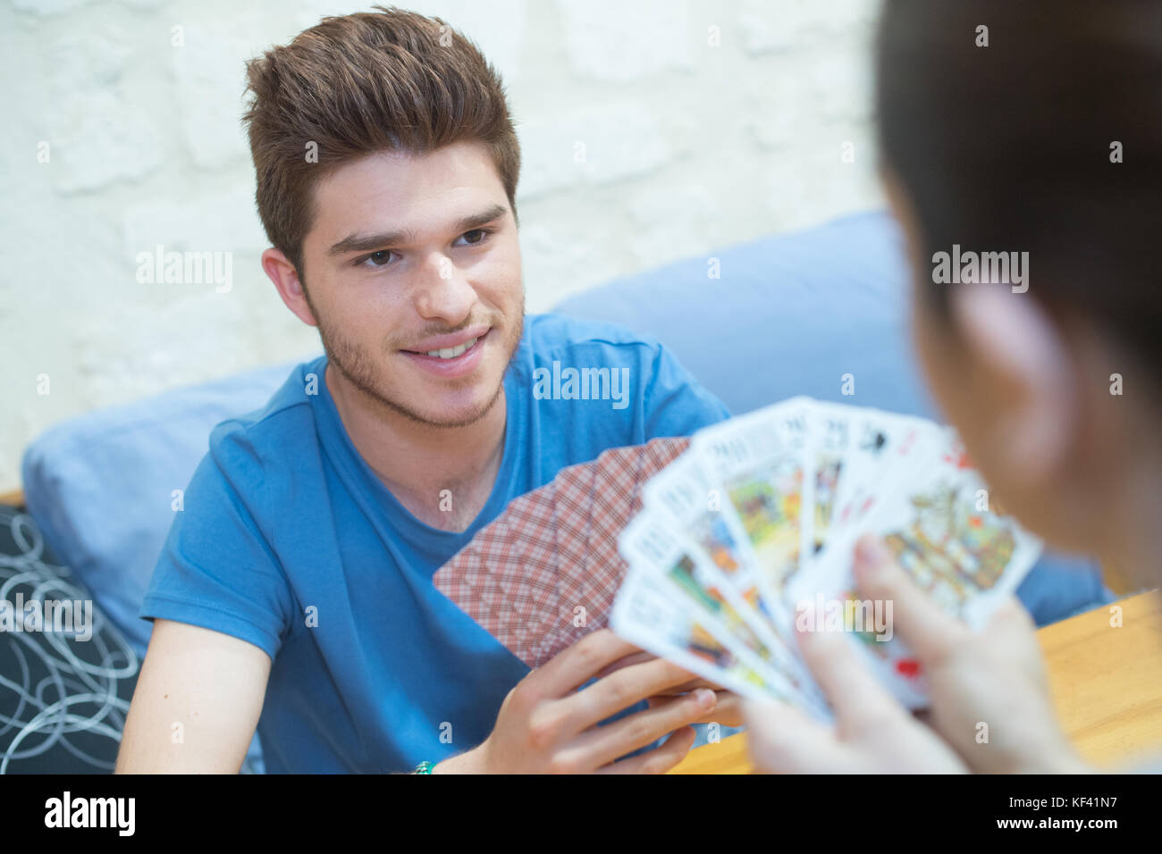 friends playing cards Stock Photo - Alamy