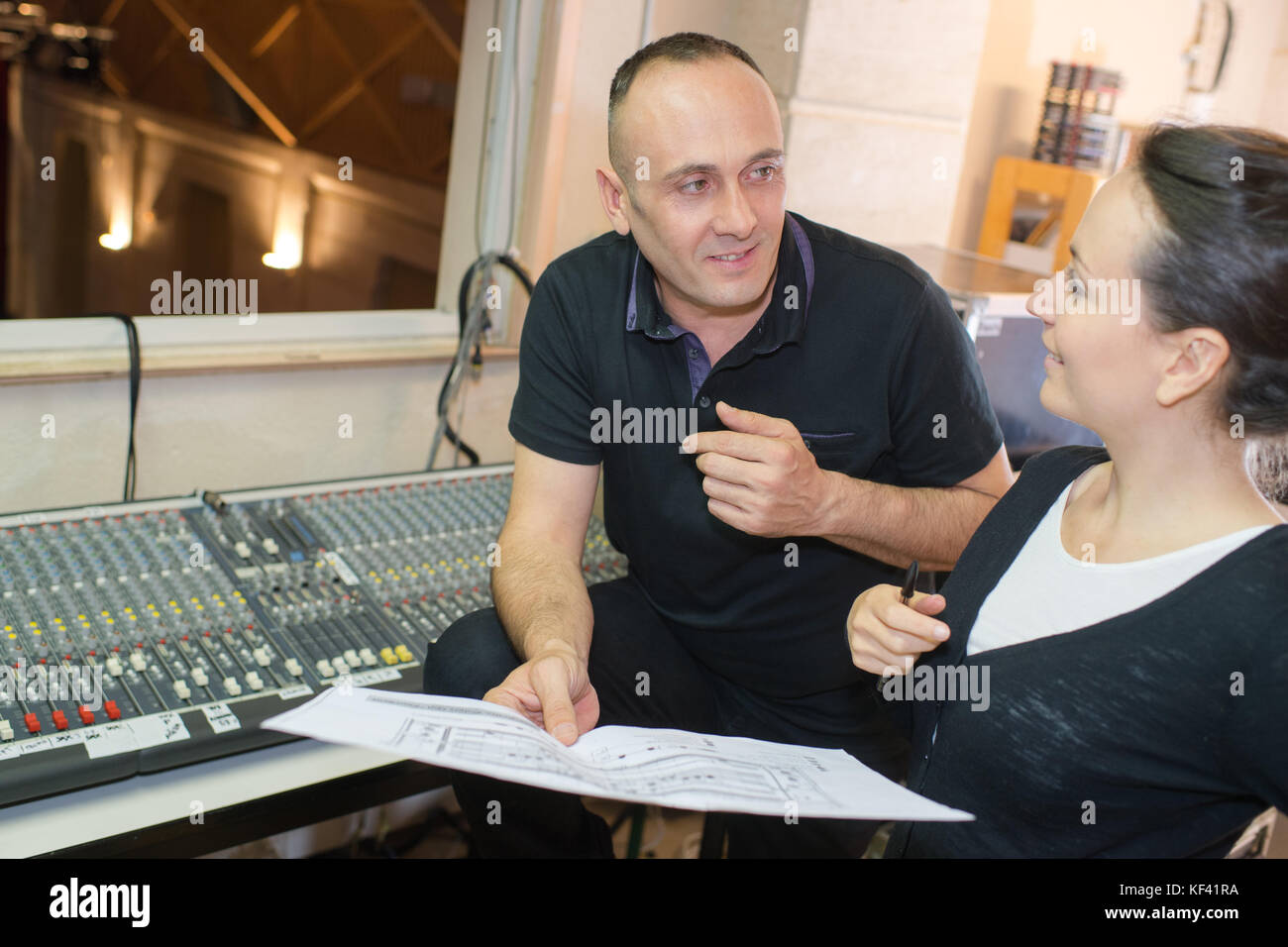 sound engineer talks to assistant Stock Photo - Alamy