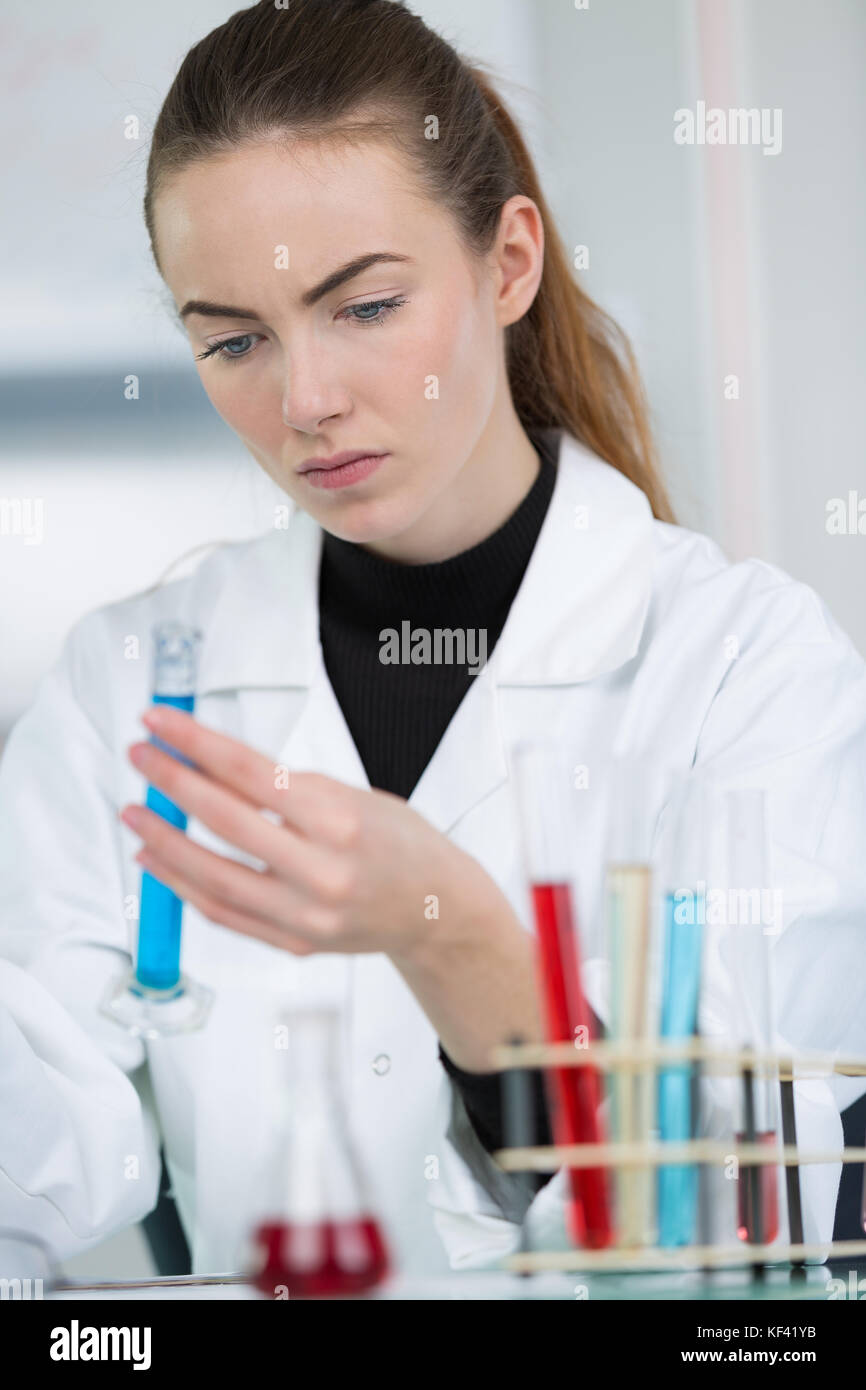 young female lab technician works on some samples Stock Photo - Alamy