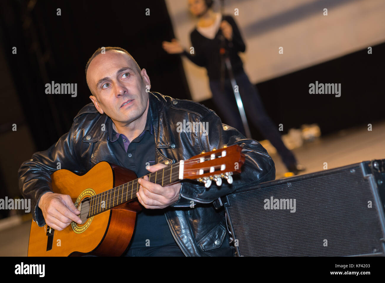 man playing guitar on a stage musical concert Stock Photo - Alamy