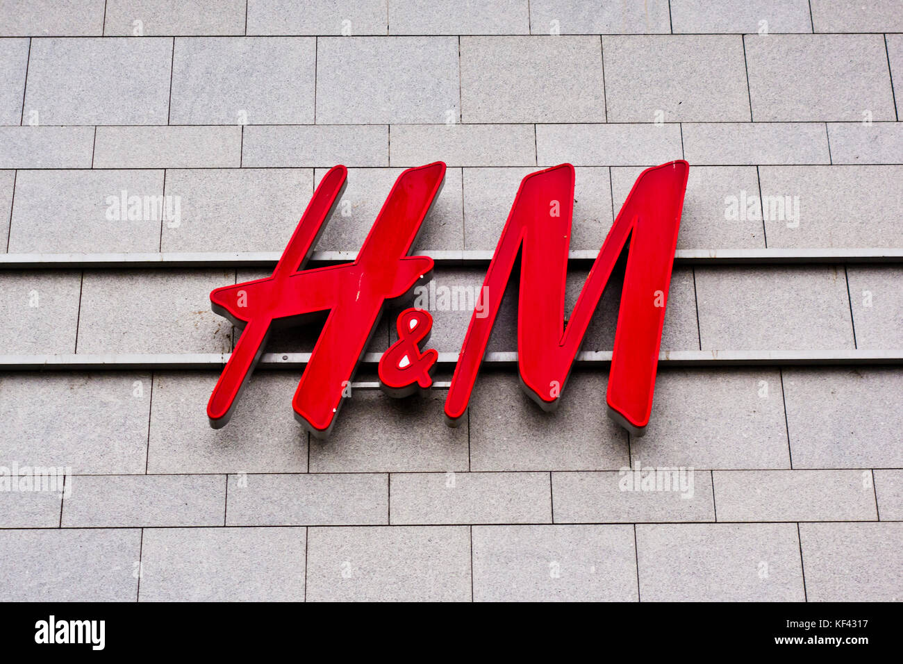H&M clothing retail logo Stock Photo - Alamy