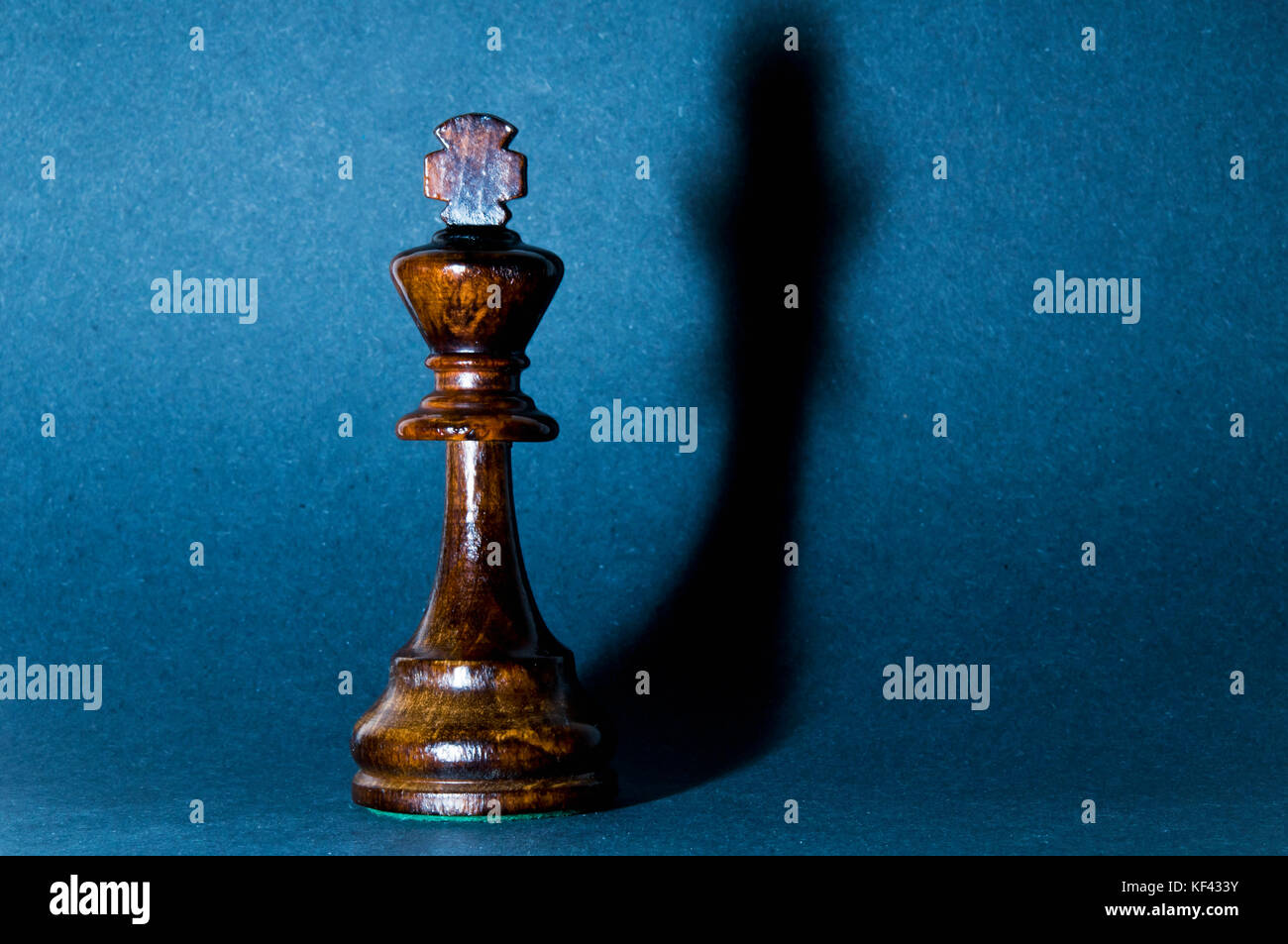 chess King piece with a shadow projected Stock Photo - Alamy