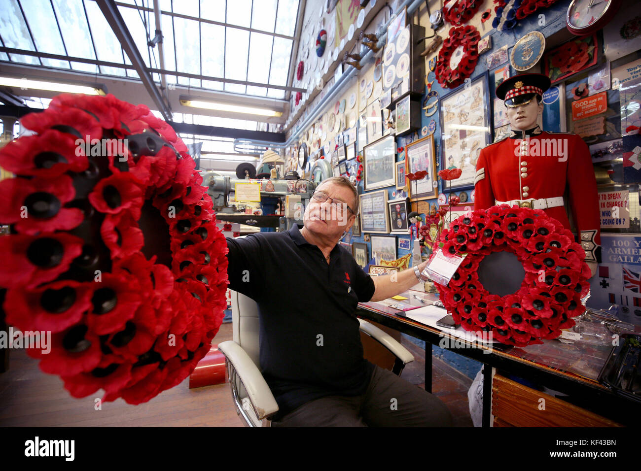 Veteran Arthur Dyke checks some of the finished poppy wreaths as final ...