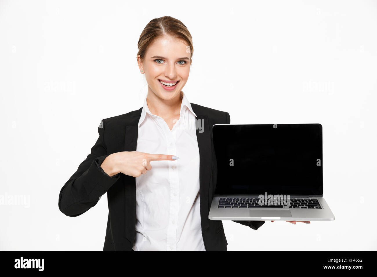 Happy blonde business woman showing blank laptop computer screen and ...