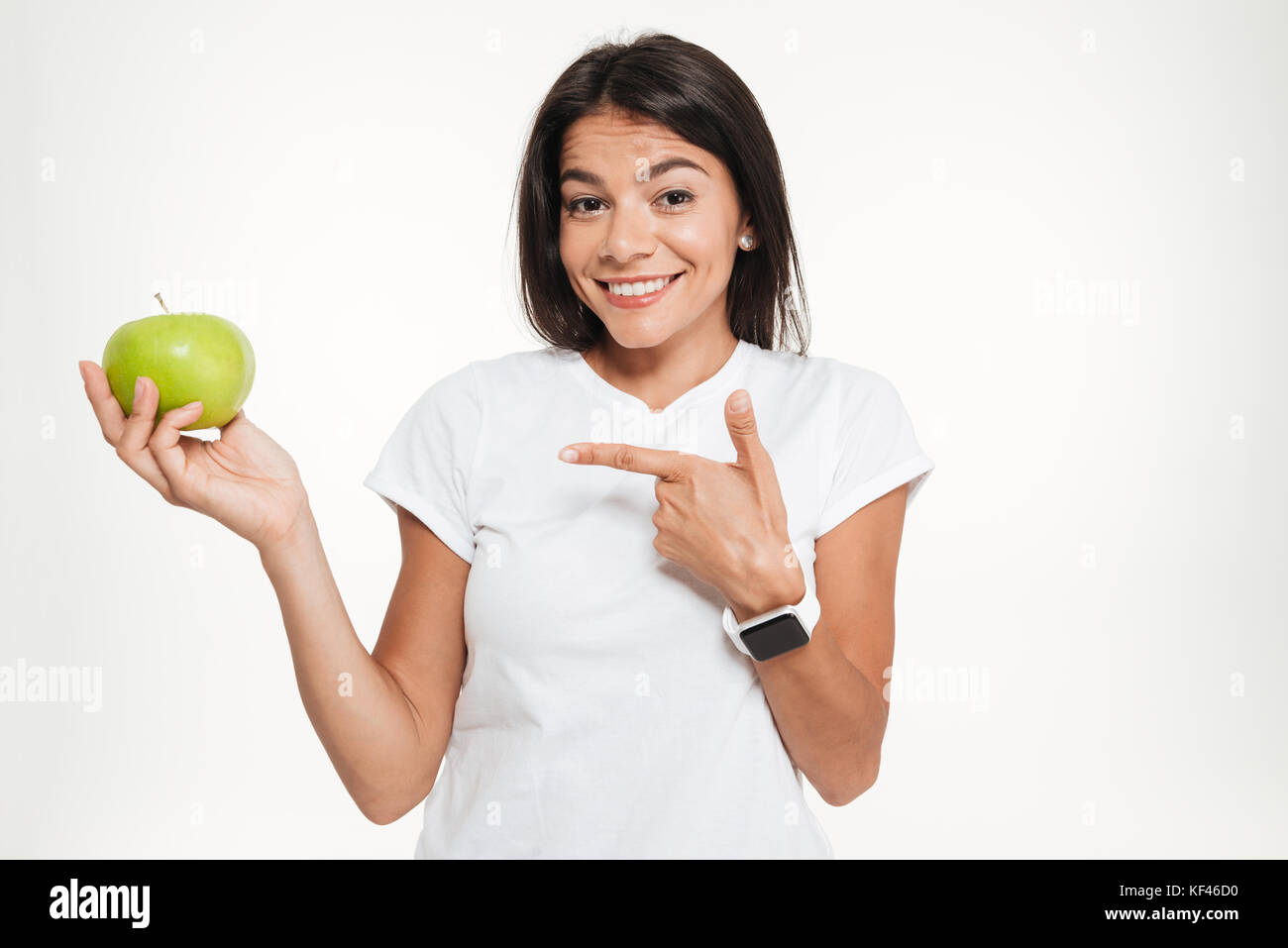 Healthy woman pointing apple hi-res stock photography and images - Alamy