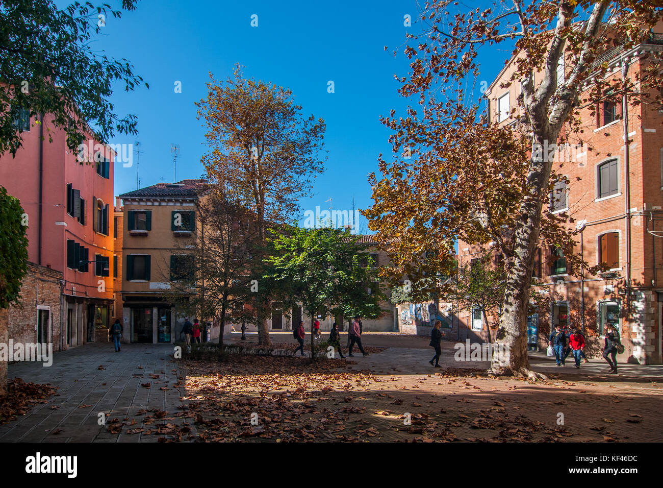 Venice, Italy. October, 2017. A little square with trees and plants ...
