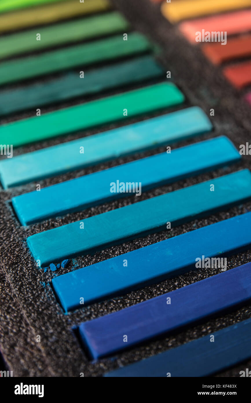 Cropped photo of new colorful chalk pastels in box, selective focus ...