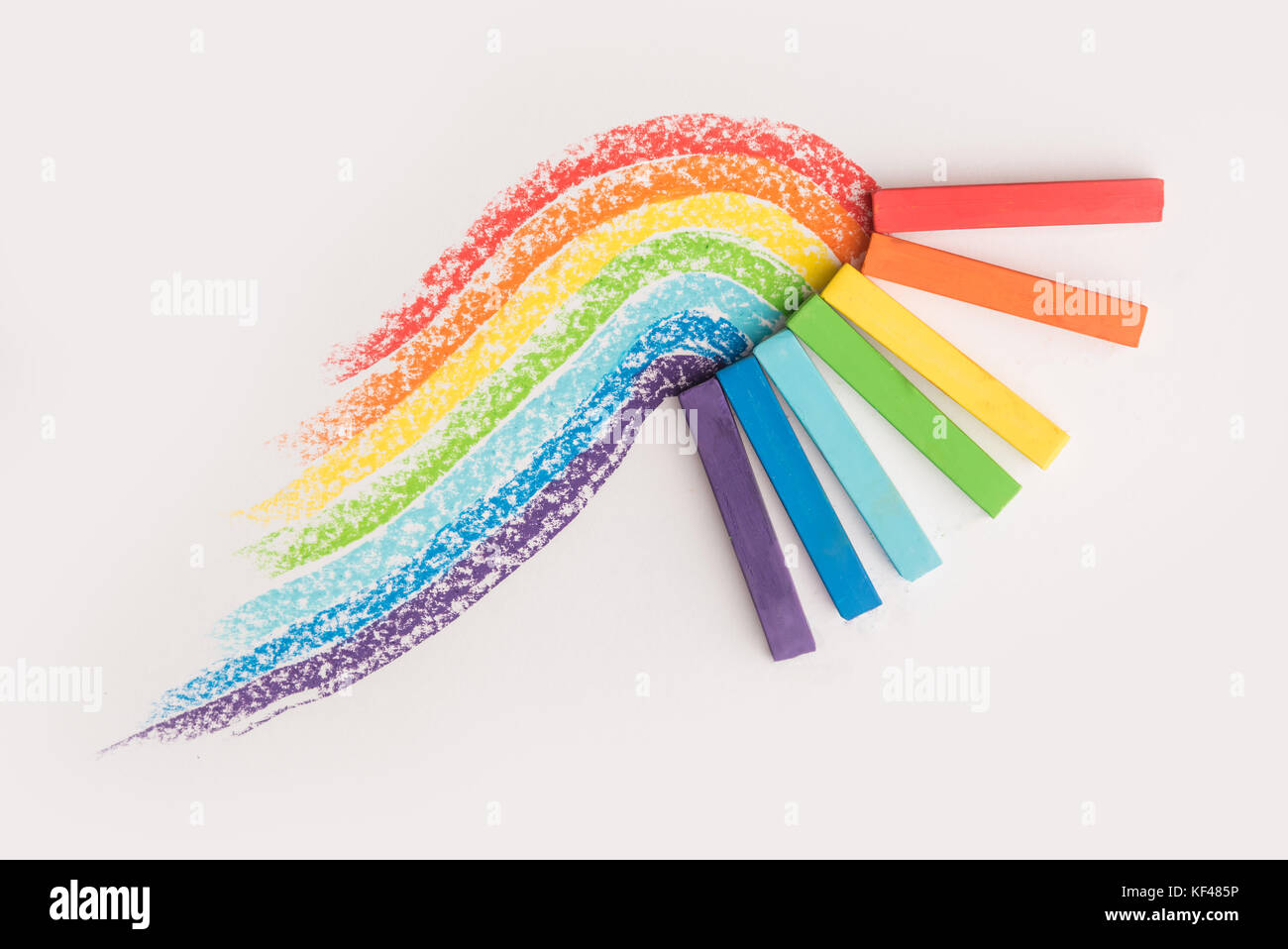 Close up of rainbow gradient made of pastel crayon chalks over the ...
