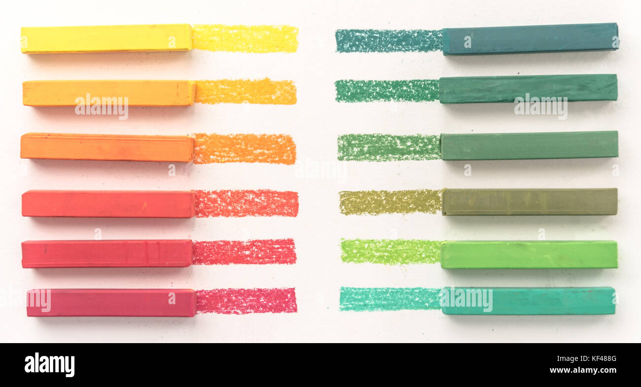 Close up view of bright colorful pastel chalks and their pigments on ...