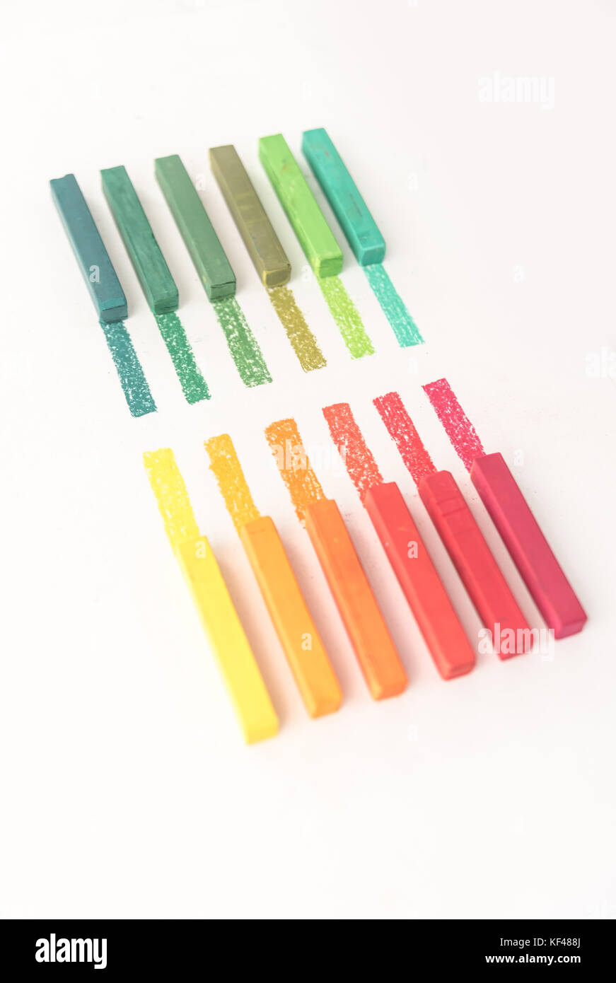 Close up photo of bright colorful pastel chalks and their pigments on ...