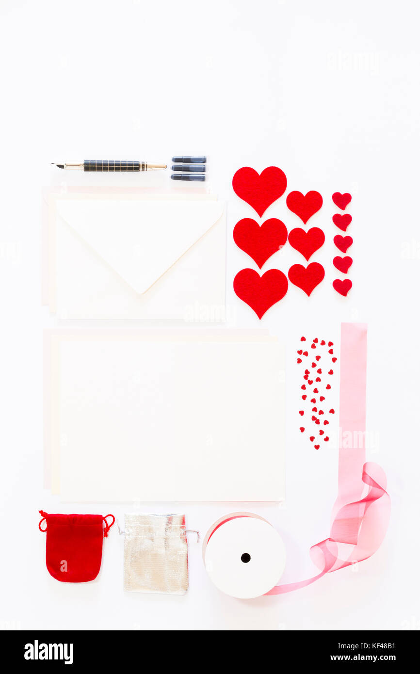 Display of love letter items on white background. Assortment of cards ...