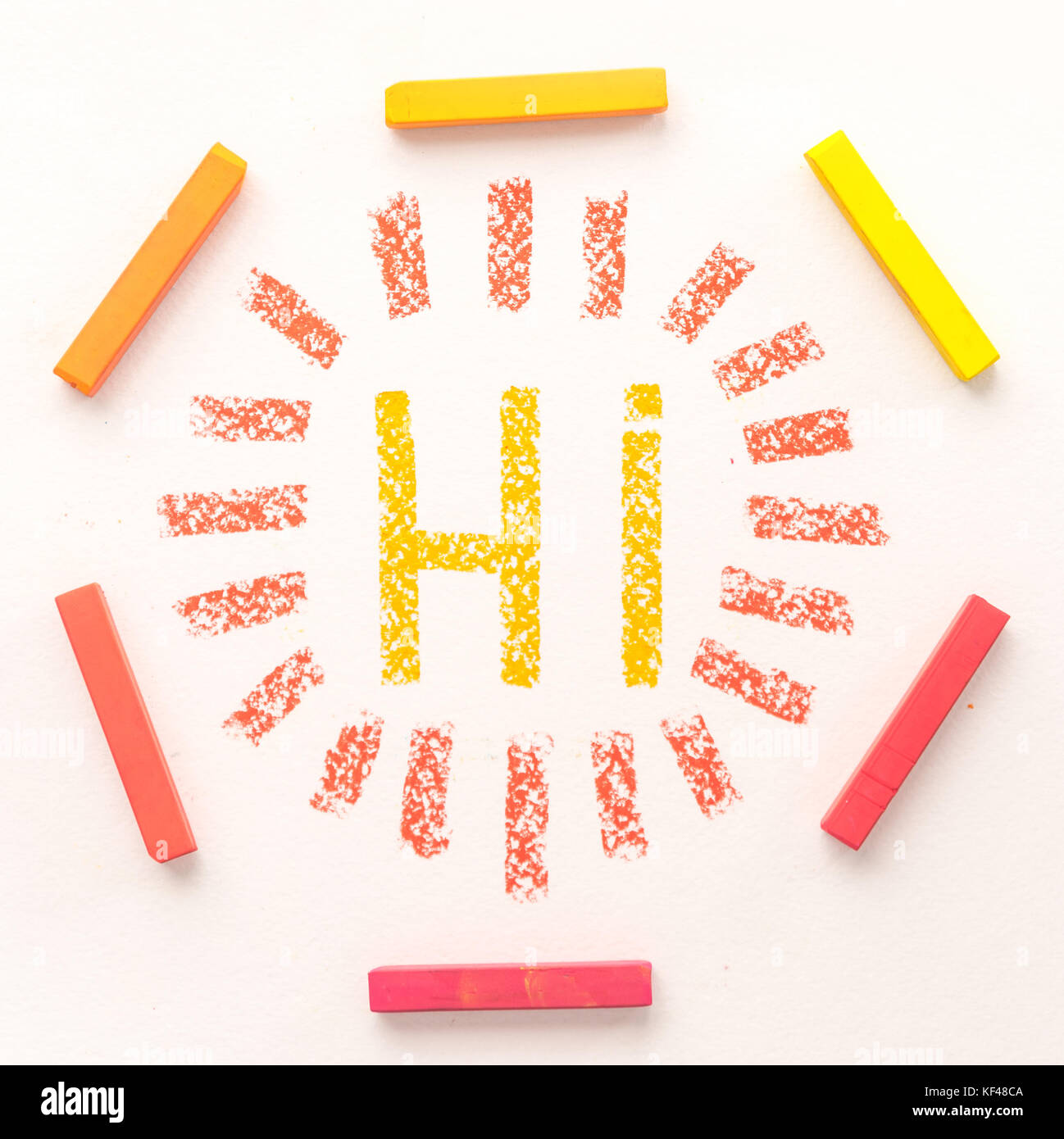Top wiew of word HI inside a frame made of colorful pastel chalks, over ...