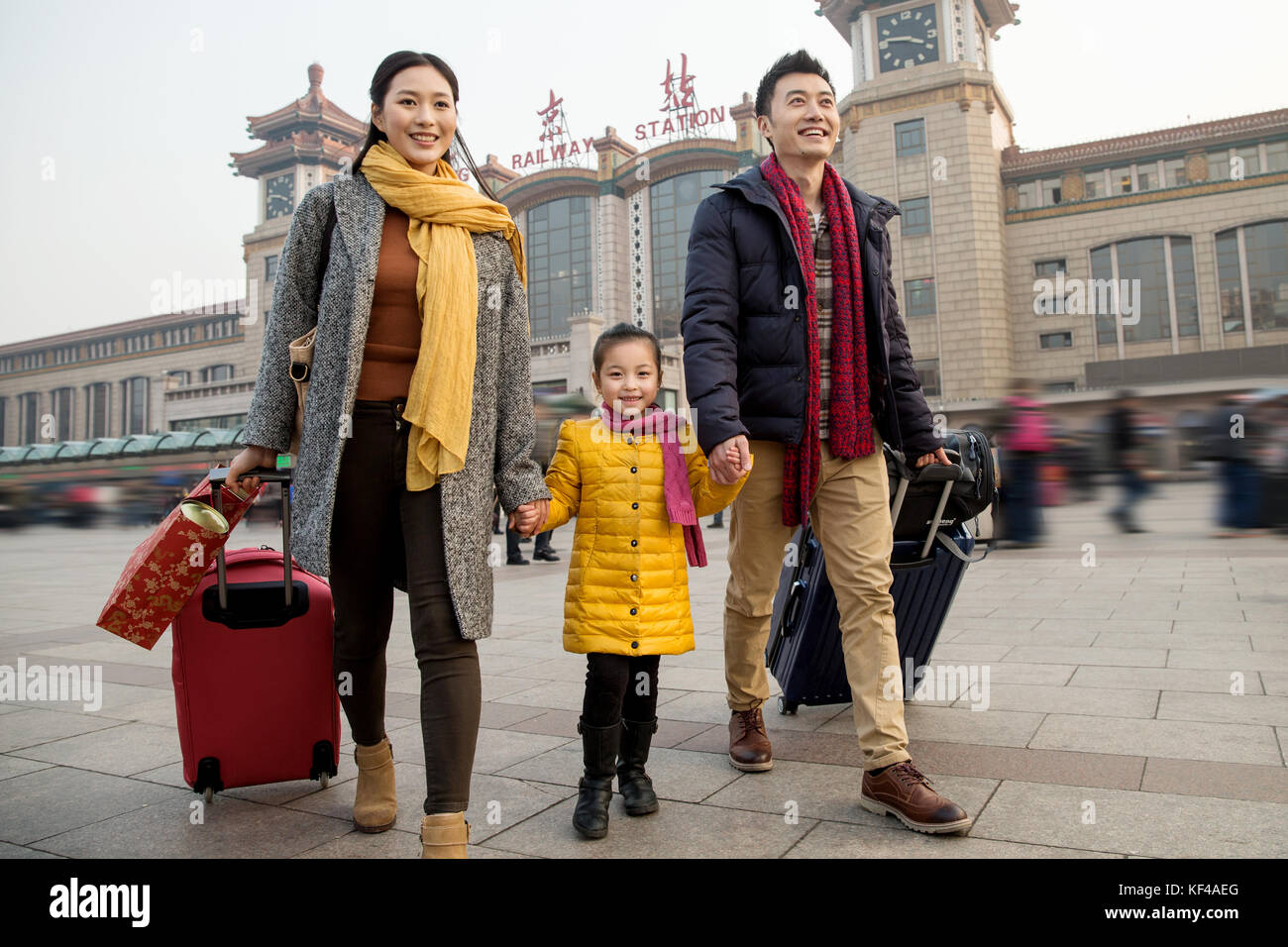 Happy family in front of the square Stock Photo - Alamy