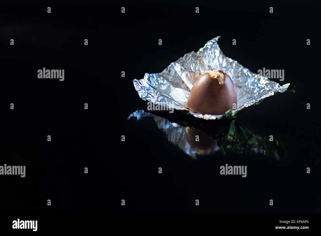 Chocolate Candy on black background Stock Photo - Alamy