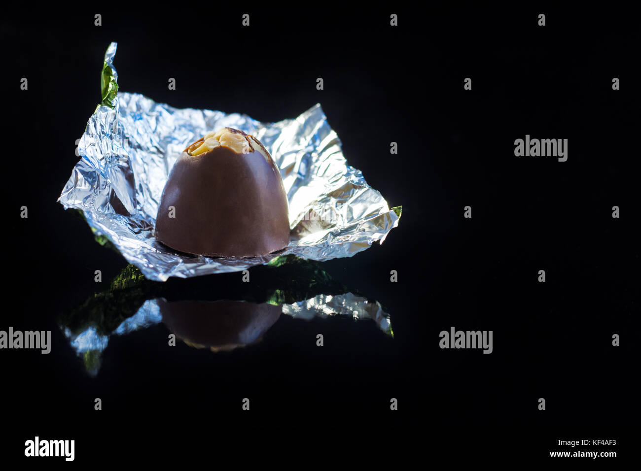 Chocolate Candy on black background Stock Photo - Alamy