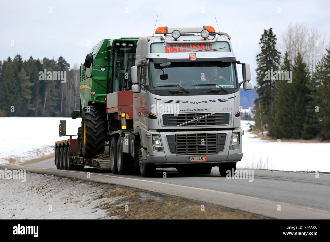 SALO, FINLAND - MARCH 4, 2016: Volvo FH16 truck hauls John Deere W330 ...