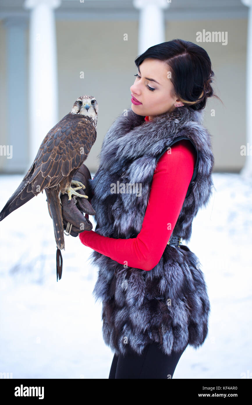 Beautiful woman with falcon Stock Photo - Alamy