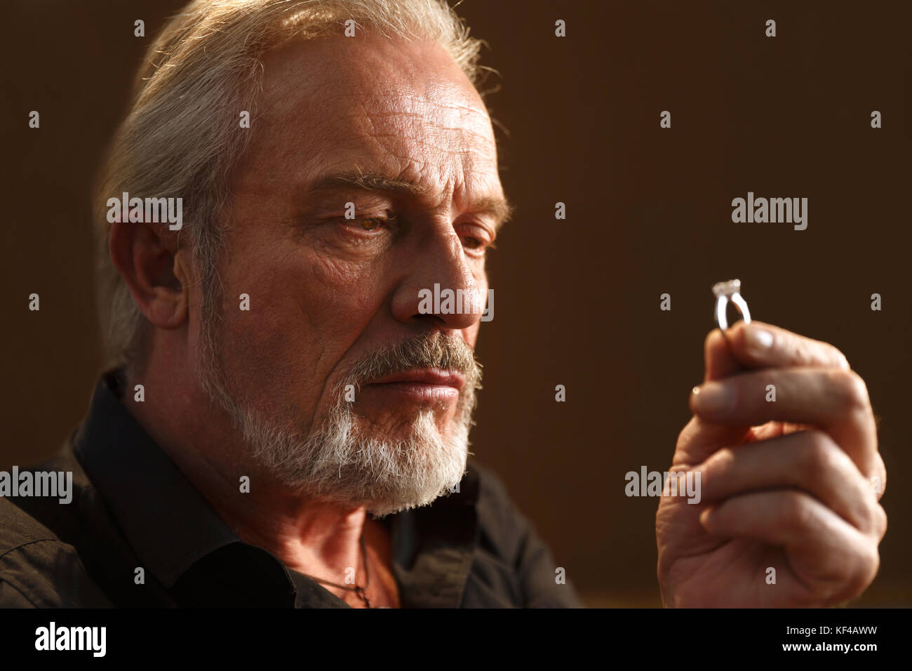 Old man with diamond ring Stock Photo - Alamy