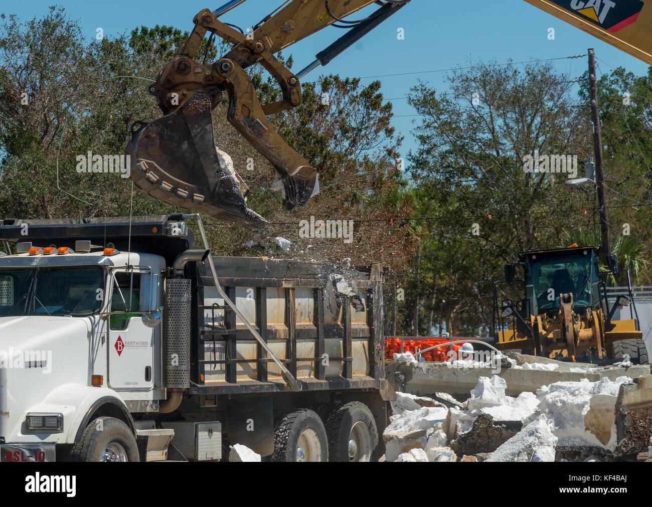 A clean-up crew picks up debris from the aftermath of Hurricane Irma ...