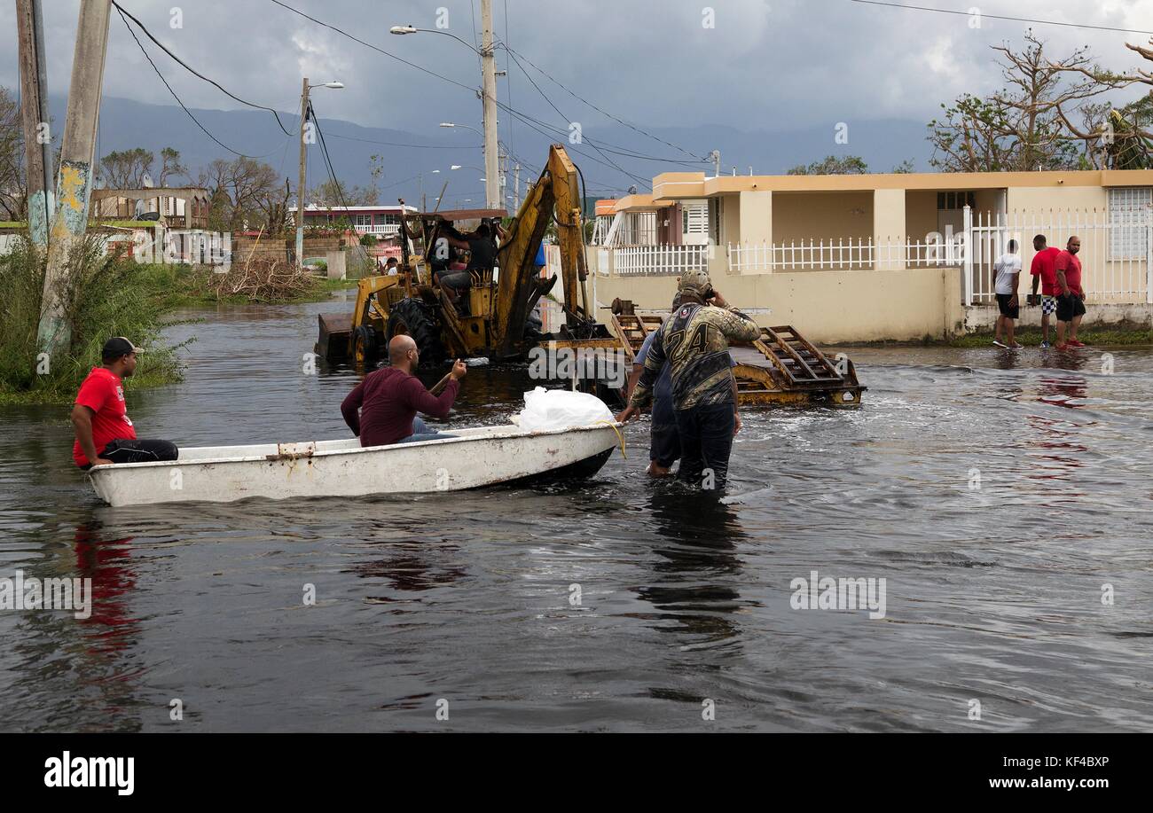 Puerto Rican residents use excavators and small boats to rescue ...