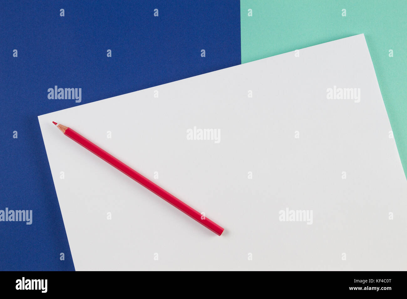 Red colored pencils on blue color background Stock Photo - Alamy
