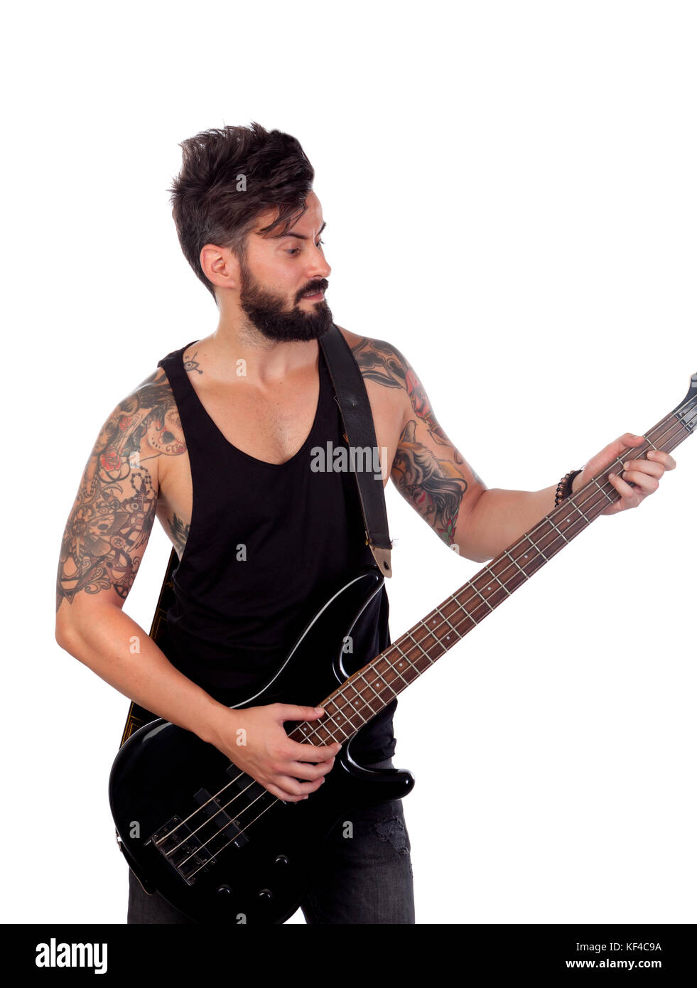 Attractive guy in black playing electric bass isolated on a white ...