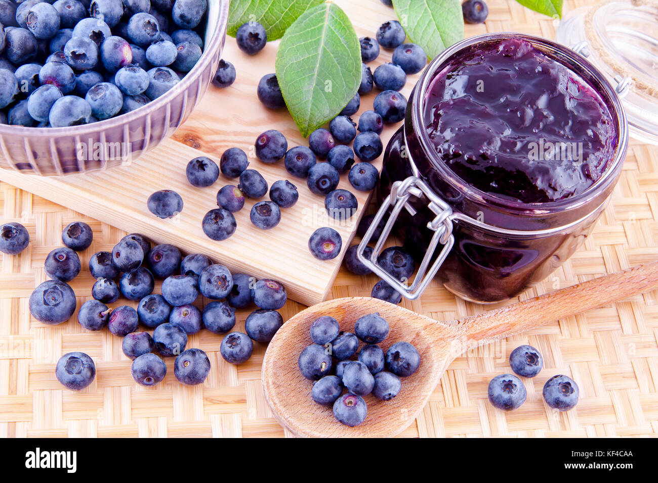 Blueberry jam and fresh fruits on the kitchen table Stock Photo - Alamy
