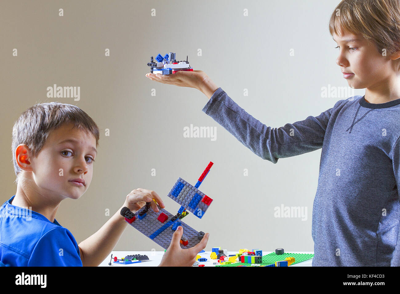 Children playing with Lego construction toy blocks Stock Photo - Alamy