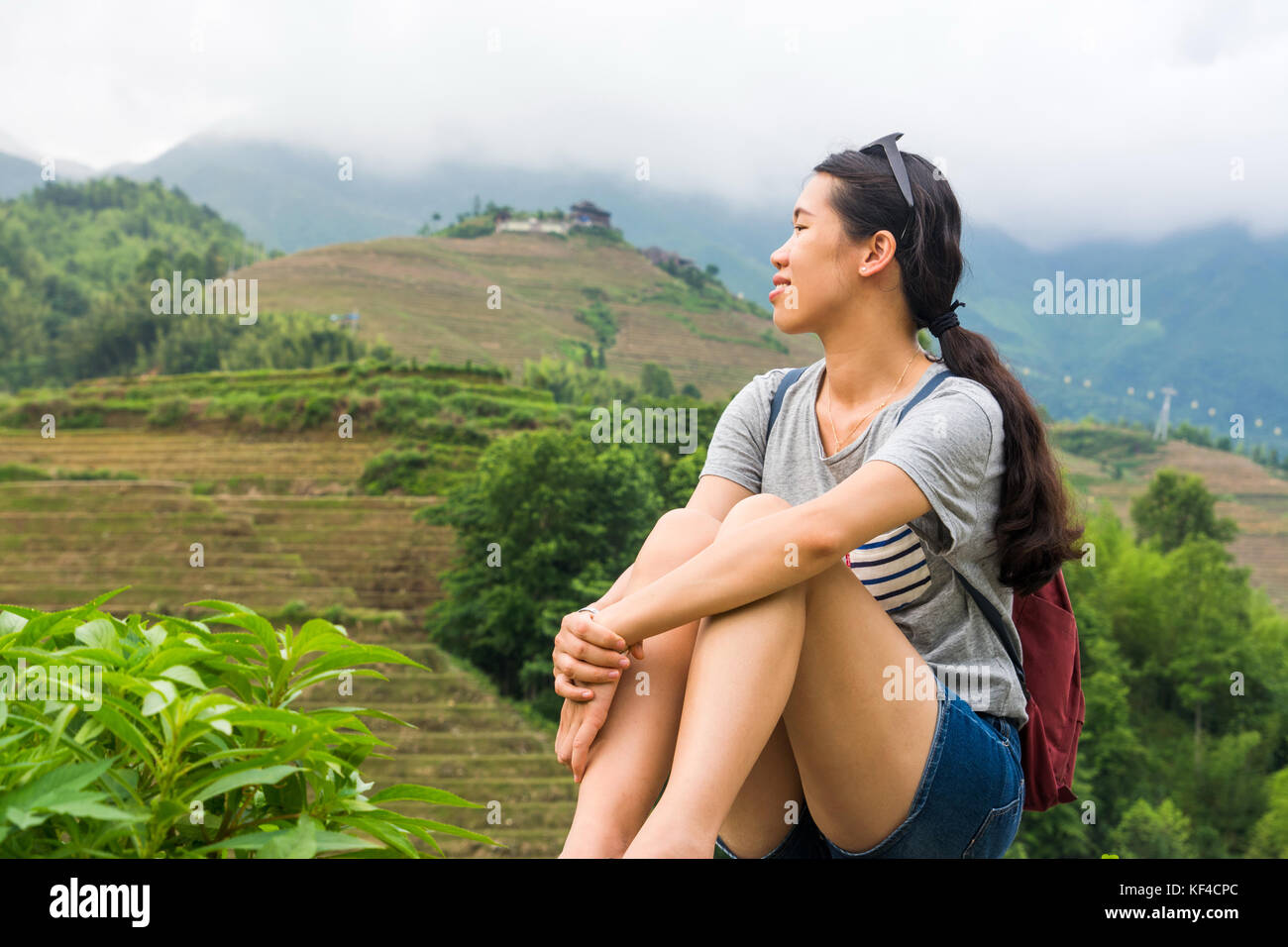 Girl admiring stunning rice terraced field scenery Stock Photo - Alamy