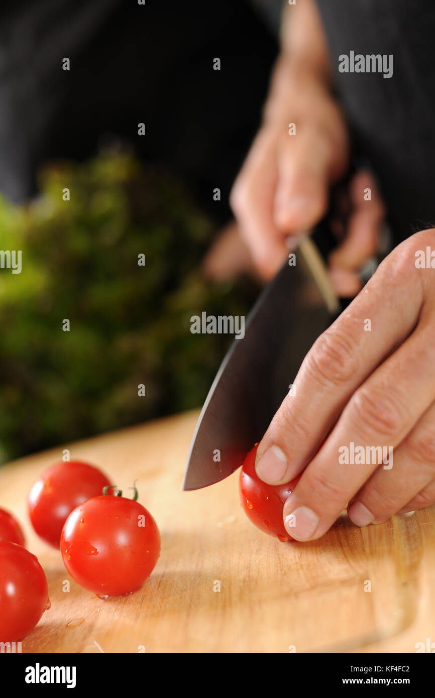 Cutting tomato slice sharp knife hi-res stock photography and images ...