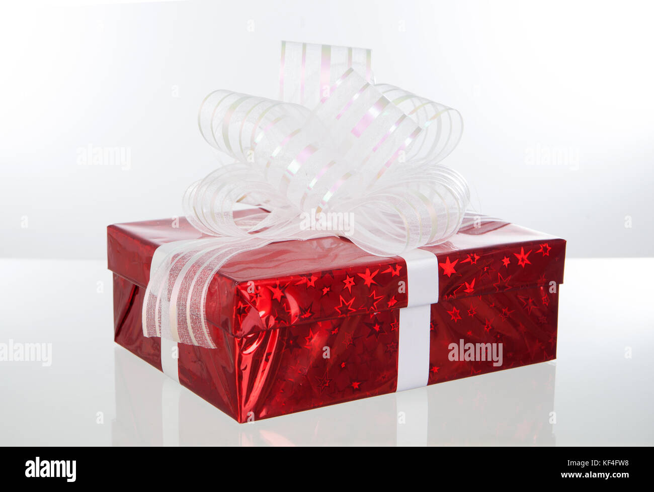Beautiful red gift with a big ribbon isolated on white background Stock ...
