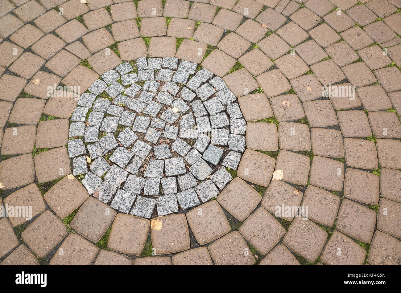 Cobble road, round pattern of a stone street pavement, background photo ...