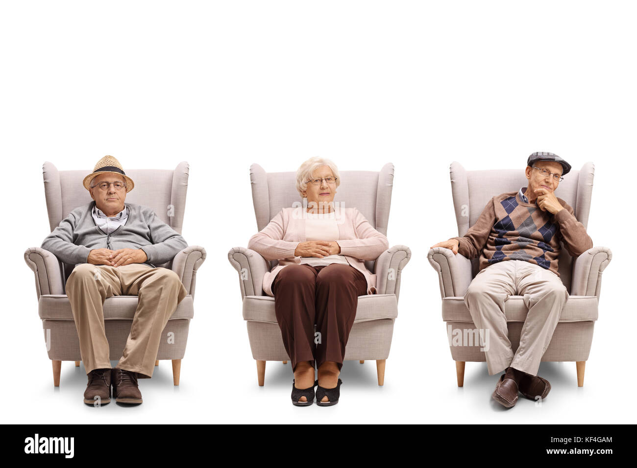 Seniors sitting in armchairs and looking at the camera isolated on ...