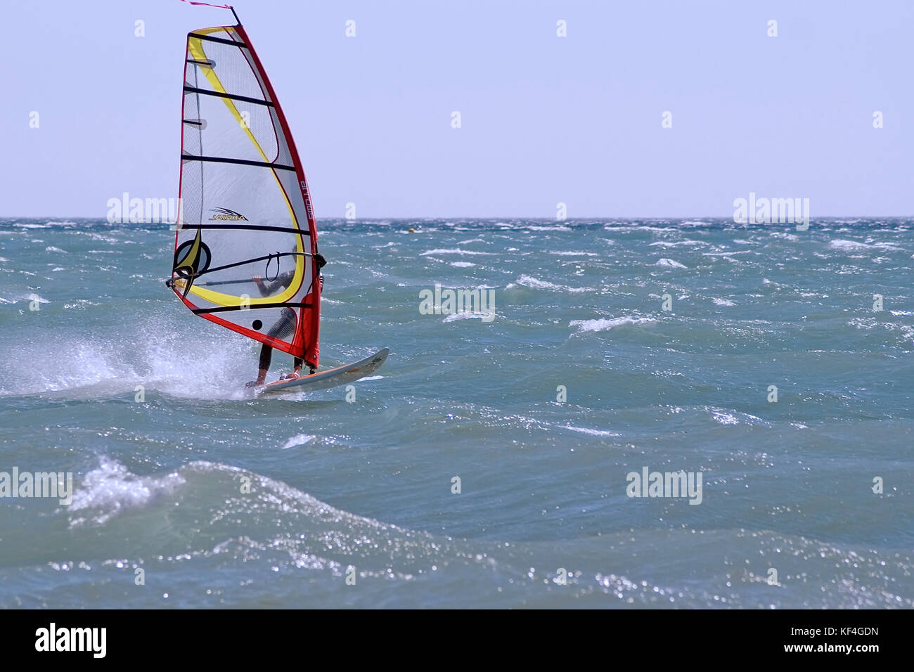 Windboarder at full speed during a windy day in Mediterranean sea Stock ...