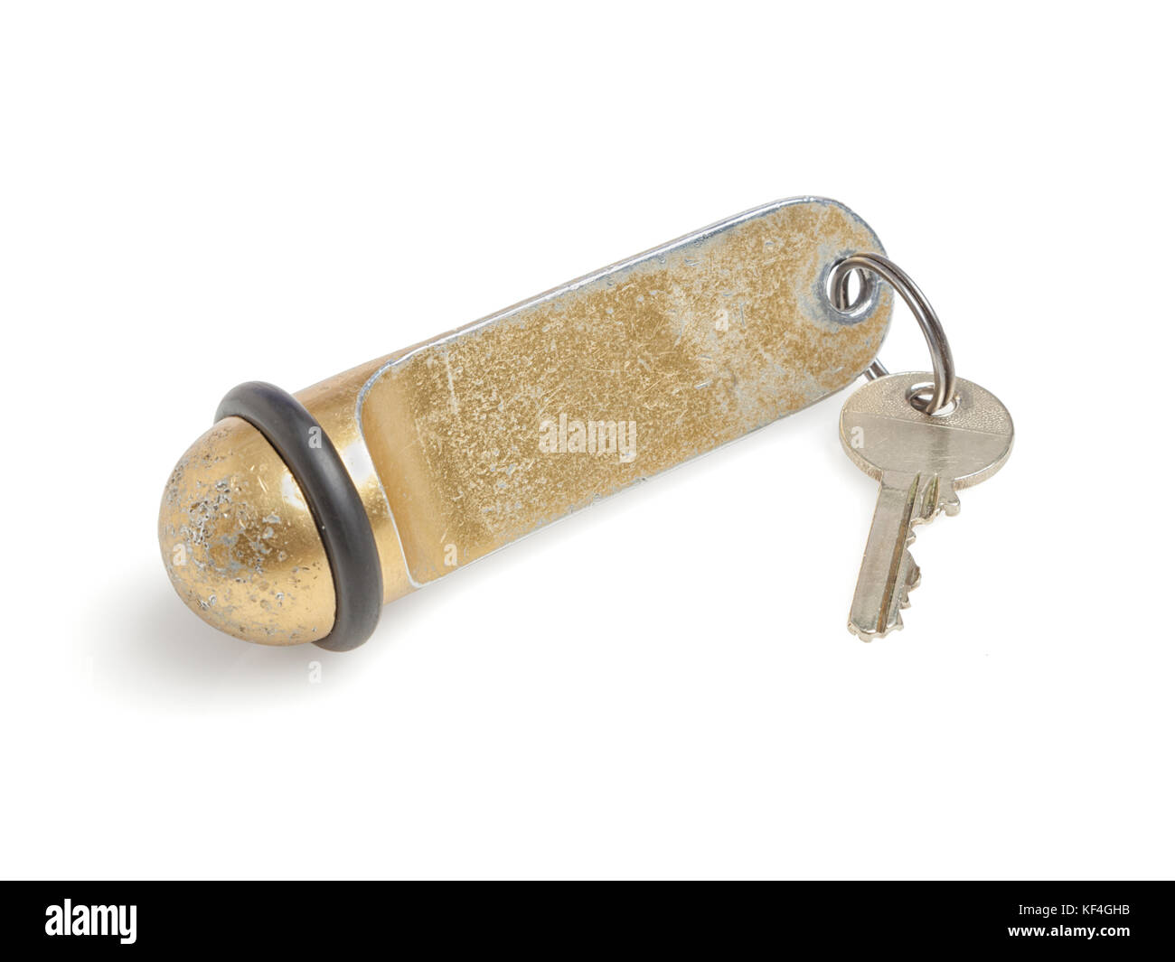 Hotel security key on old-fashioned metal tag isolated on white ...