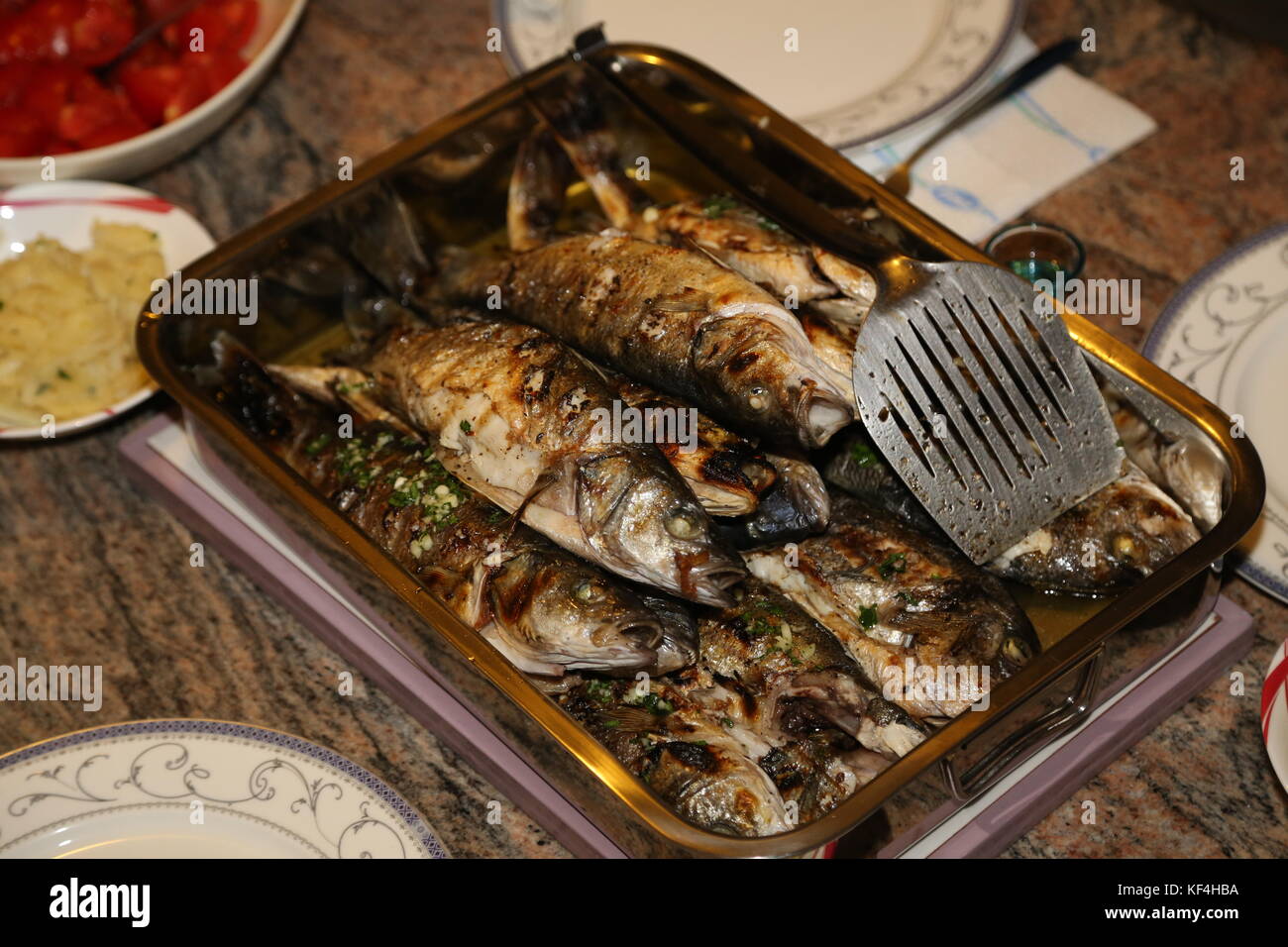 Fish grill / There are fish on the grill and grilled. An raw freshwater ...