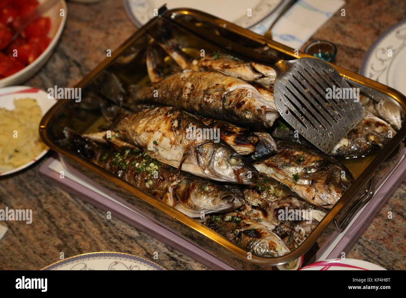 Fish grill / There are fish on the grill and grilled. An raw freshwater ...