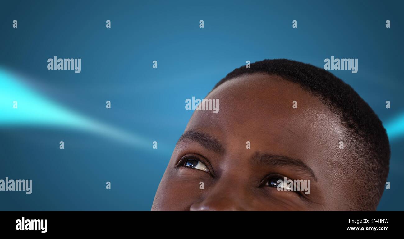 Digital composite of Man looking up with blue background Stock Photo ...