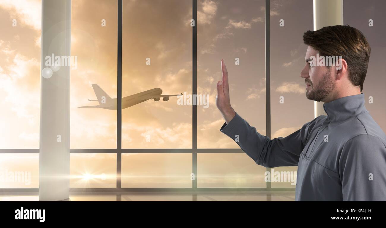 Digital composite of Businessman waving goodbye to plane out window ...