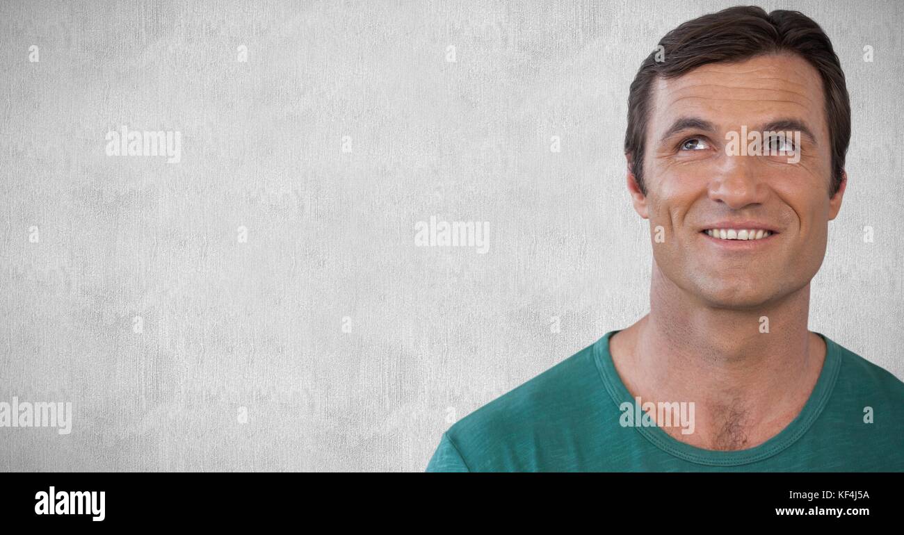 Digital composite of Man looking up with white stone background Stock ...