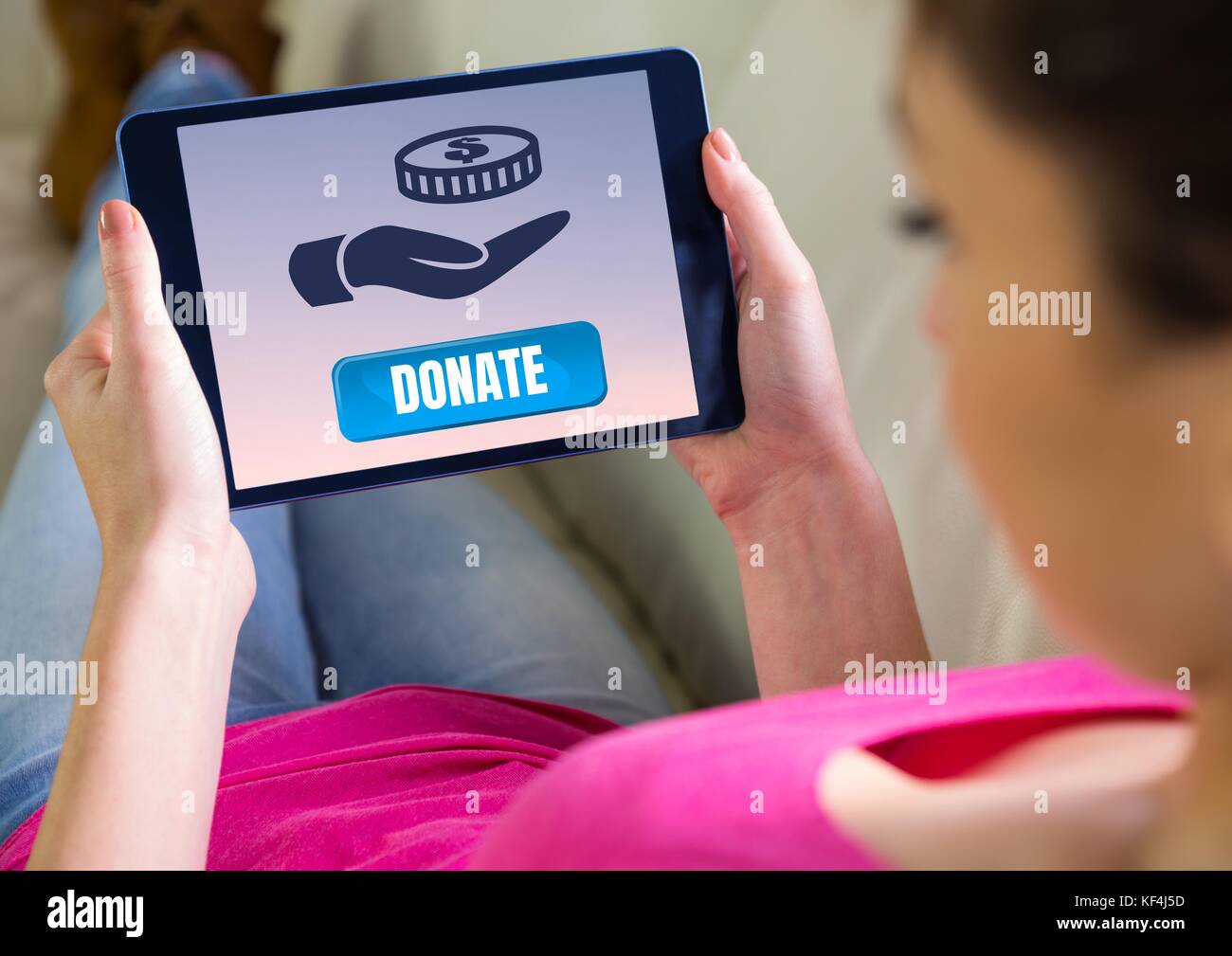 Digital composite of Woman holding tablet with donate button and hand ...