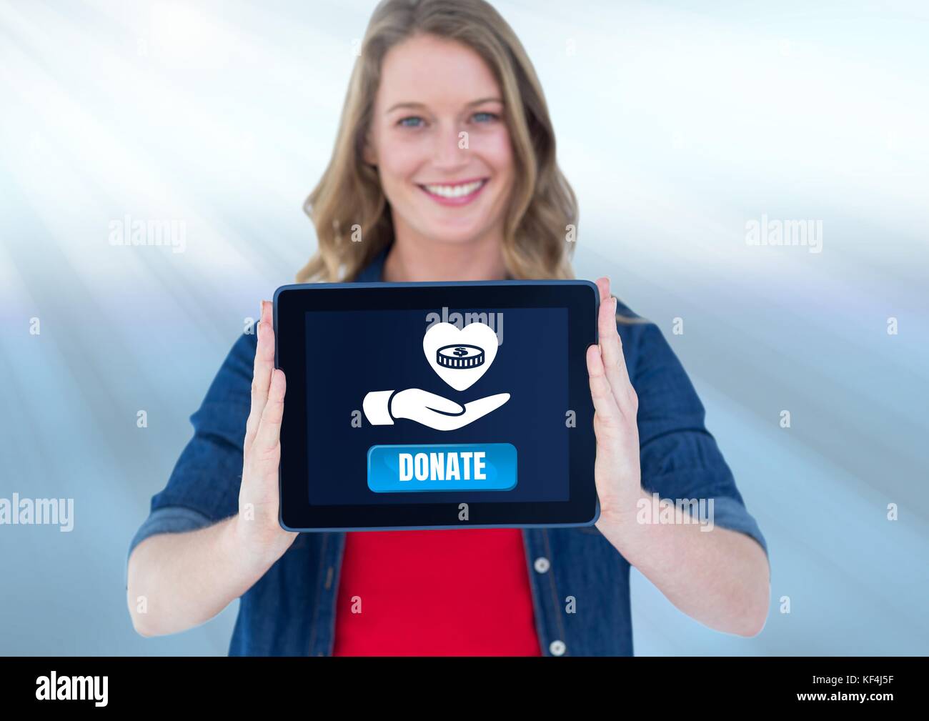 Digital composite of Woman holding tablet with donate button and hand ...